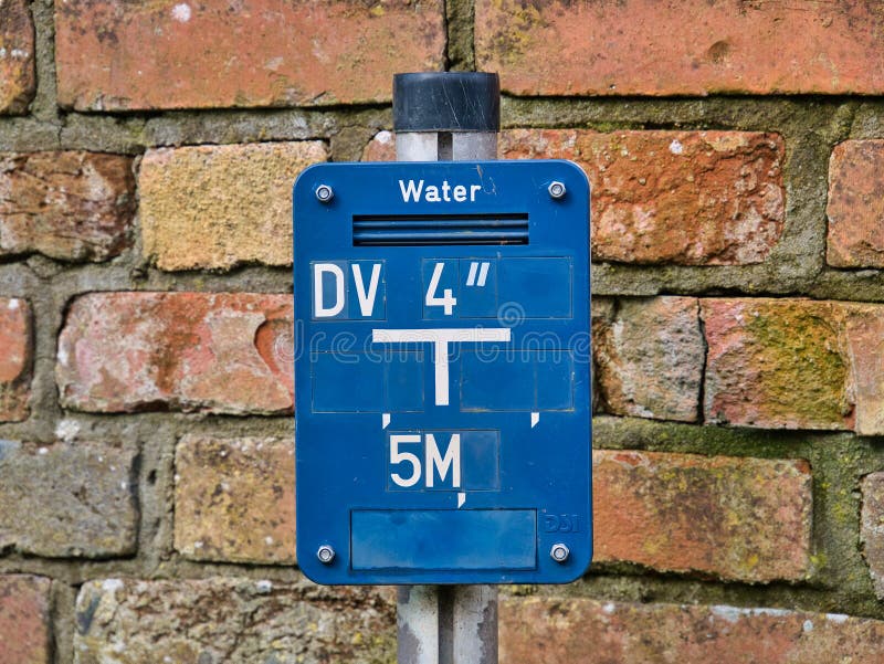 A Blue, Rectangular Sign on a Metal Post Indicates the Location of ...