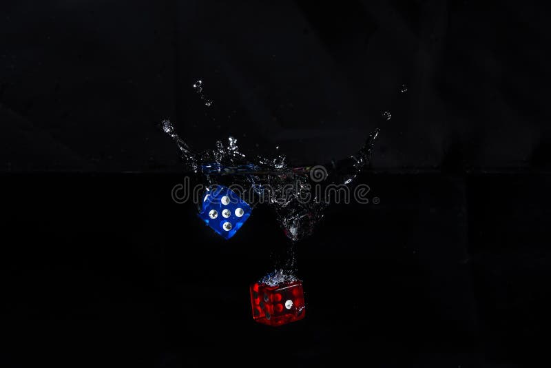 Dice Dropped into the Water, on a White Background. Stock Image - Image ...