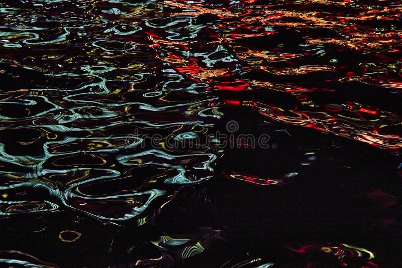 Blue and Red Lights Reflecting Off Waves of Water in River Stock Photo ...