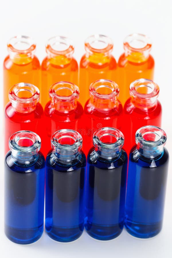 Blue, Red and Orange Liquid in Chemical Lab Test Tubes on White ...