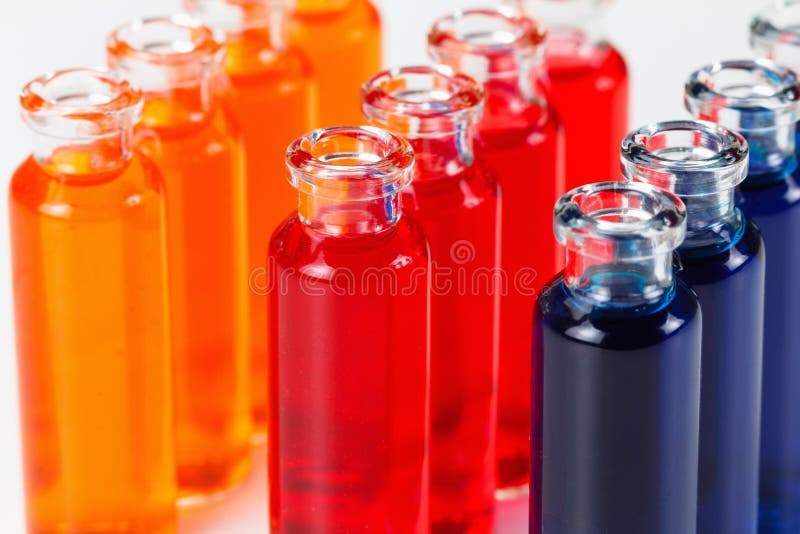 Blue, Red and Orange Liquid in Chemical Lab Test Tubes on White ...