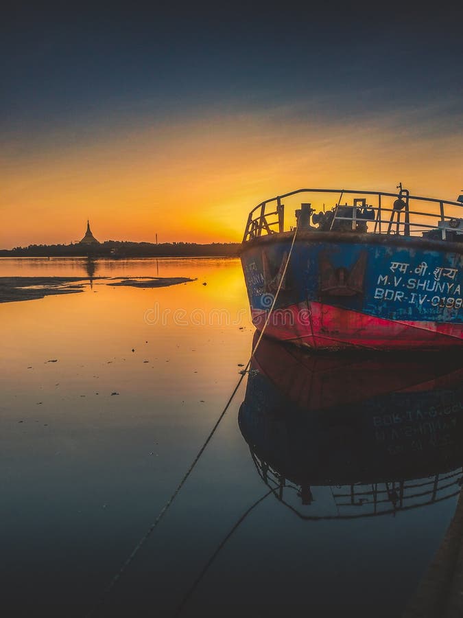 Blue and Red Ship during Golden Hour Stock Photo - Image of shore, calm ...