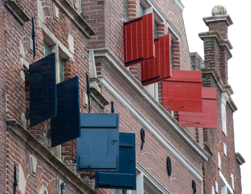 Blue and red shutters stock image. Image of rustic, facade - 18815383