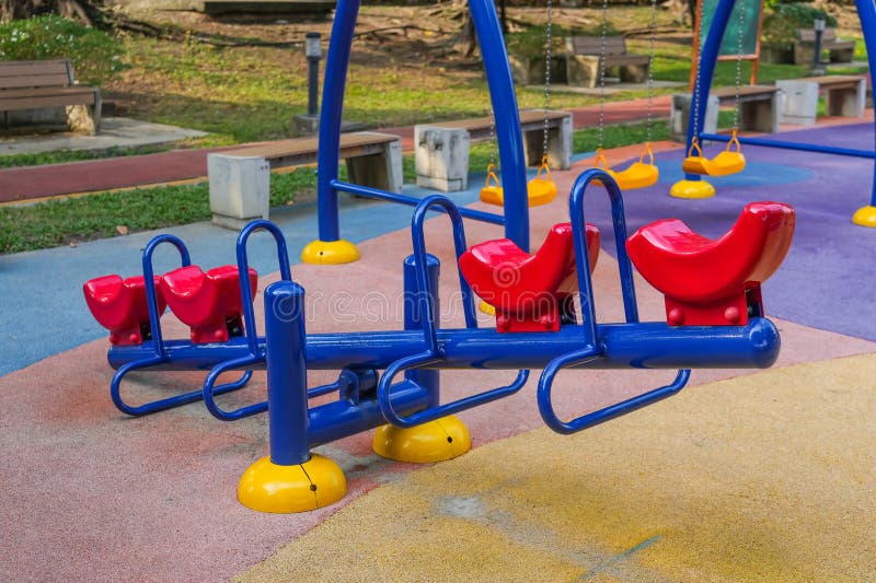 Blue Red Swing on a Playground in a City Park Stock Photo - Image of ...