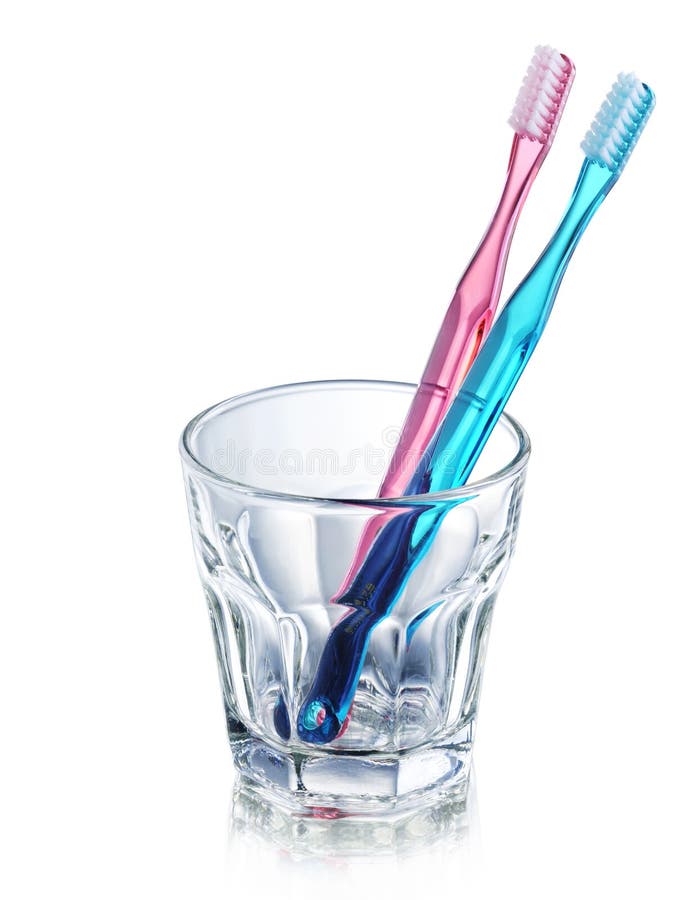 Colorful Toothbrushes in a Glass on Background. Stock Image - Image of ...