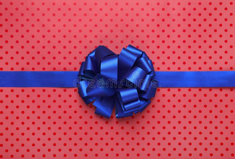 Blue Ribbon with Bow on Red Polka Dot Wrapping Paper, Top View Stock ...
