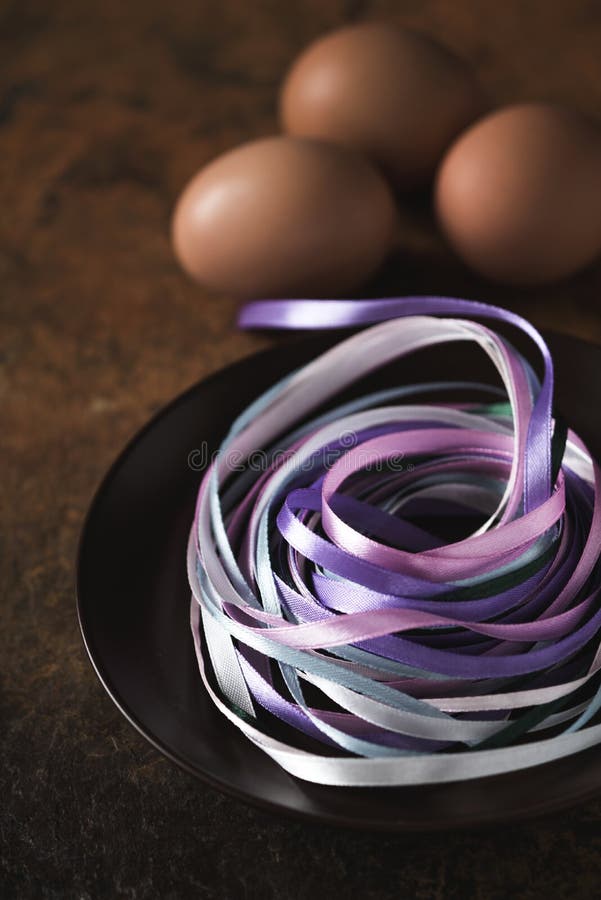Blue Ribbons in the Plate with Blurred Eggs Stock Photo - Image of dish ...