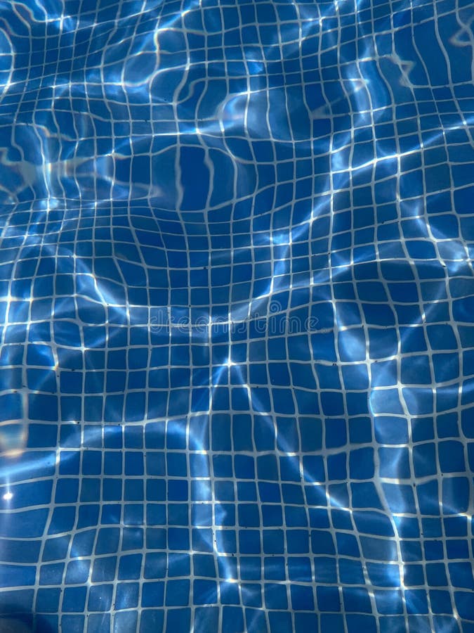Blue Rippled Water in the Swimming Pool with Sun Reflection Stock Photo ...