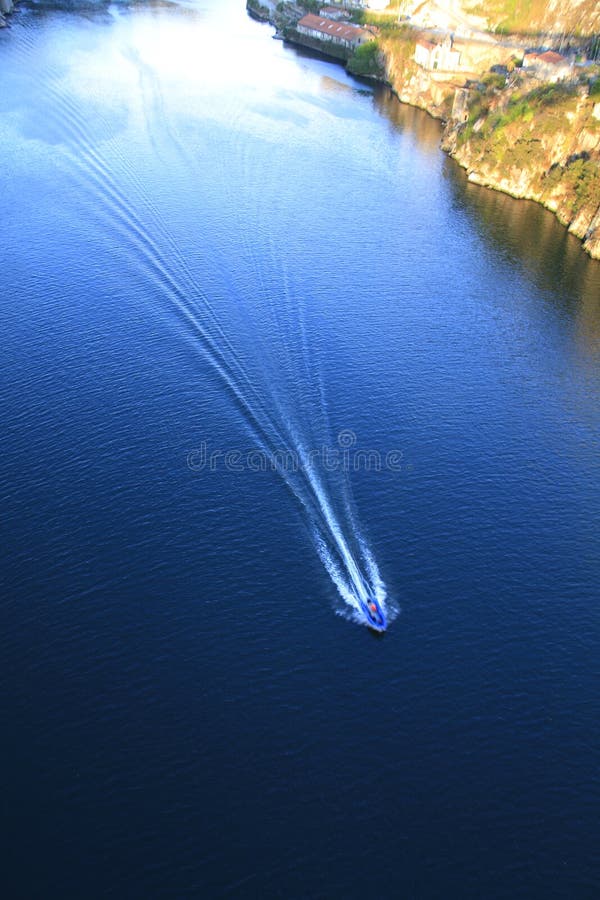 Blue River with Boat Making a Wave Stock Photo - Image of making, river ...