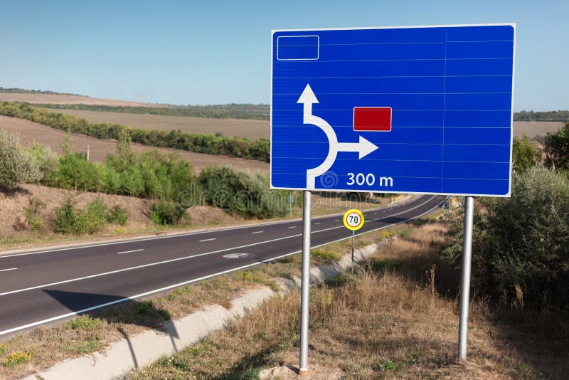Blue Road Sign Showing Direction Near Highway. Stock Image - Image of ...