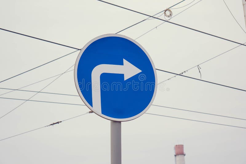 Blue road sign, turn right stock image. Image of directional - 174426559