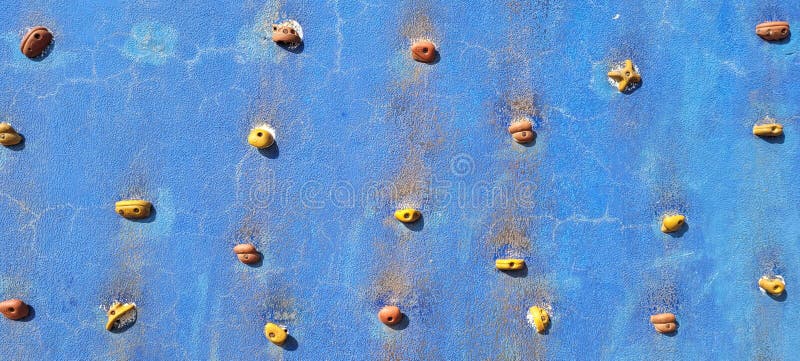 Blue Rock Climbing Wall with Rustic Texture and Dots Stock Photo ...