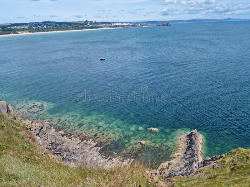 A Blue rocky ocean scene stock photo. Image of horizon - 255533686