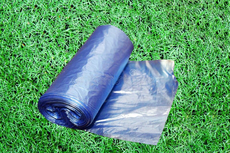 Blue Roll of Plastic Garbage Bags on the Grass Stock Photo - Image of ...