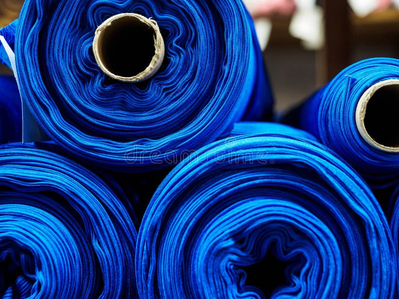 Blue Rolls of Knitted Fabric. Classic Blue Color Stock Photo - Image of ...