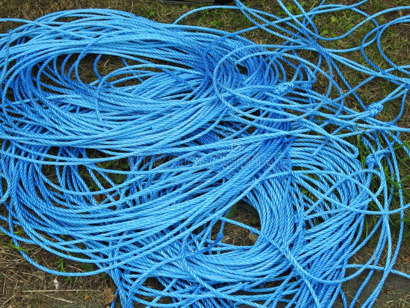 Blue rope on the ground stock photo. Image of ground - 190935636