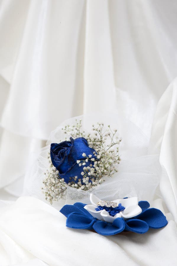 A Blue Roses and Wedding Rings Stock Photo - Image of jewel, beautiful ...