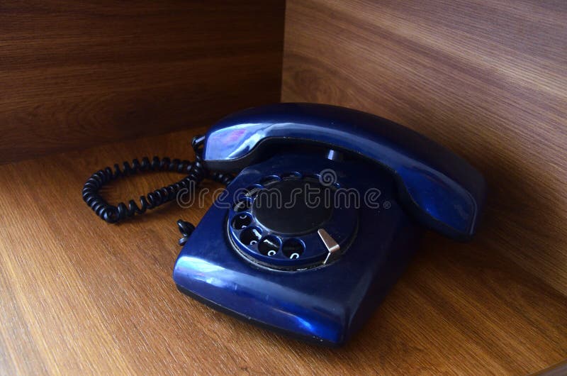Old Blue Rotary Telephone on a Brown Background Stock Image - Image of ...