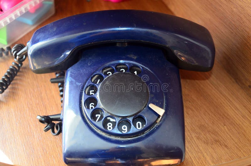 Old Blue Rotary Telephone on a Brown Background Stock Photo - Image of ...