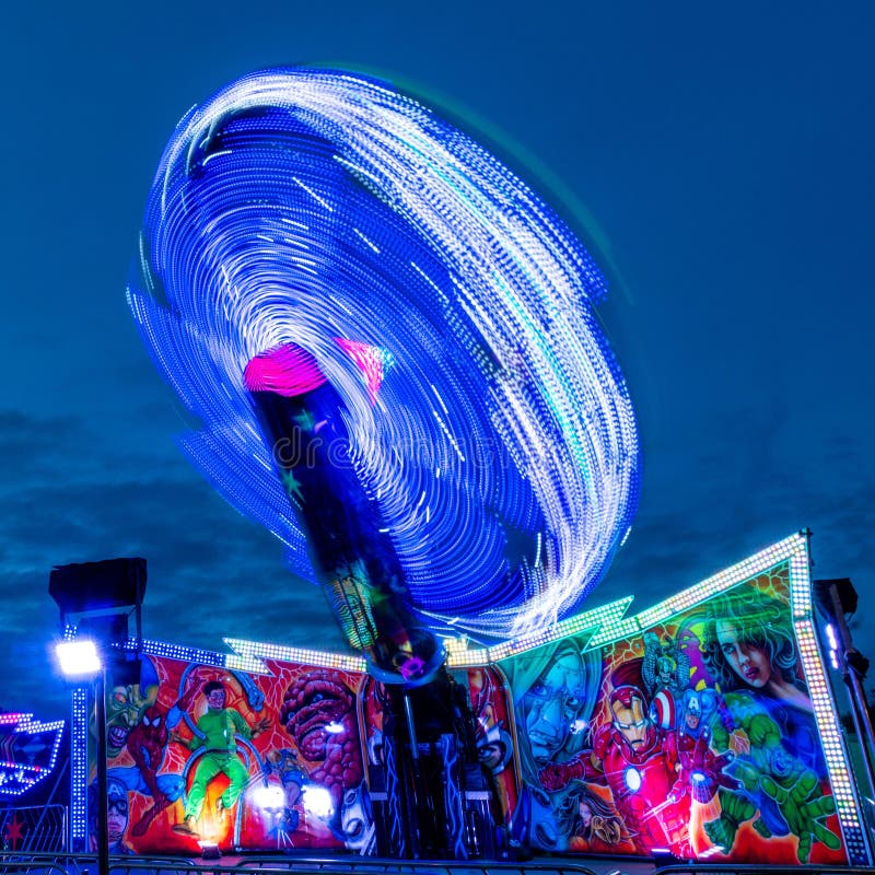 Blue Rotating Funfair Ride at Night, Light Trails, Long Exposure ...