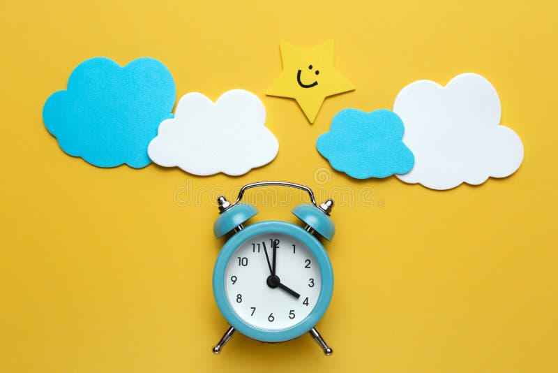 Blue Round Alarm Clock, Star and Clouds on the Yellow Background. Stock ...