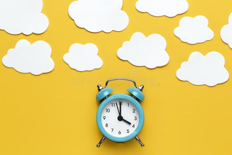 Blue Round Alarm Clock and White Cloud on the Yellow Background. Stock ...