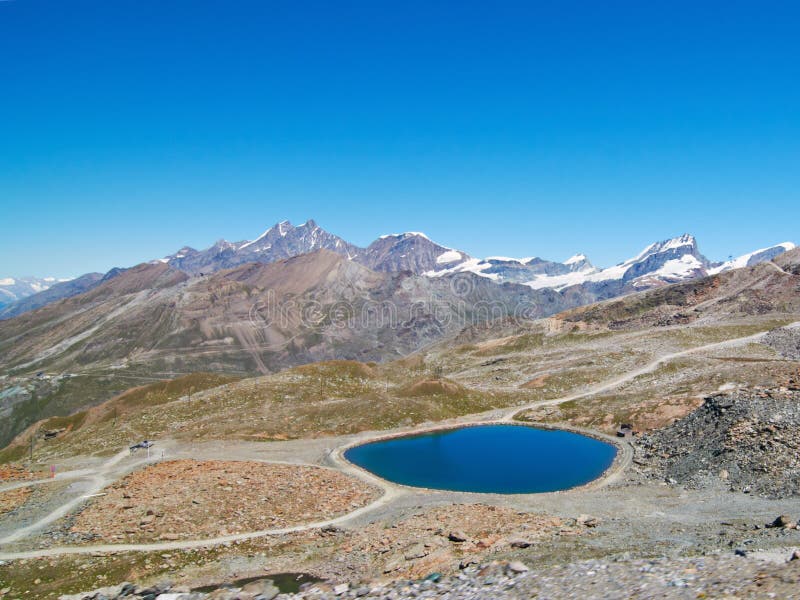 Blue Round Lake in Mountains Stock Image - Image of mountain, lake ...