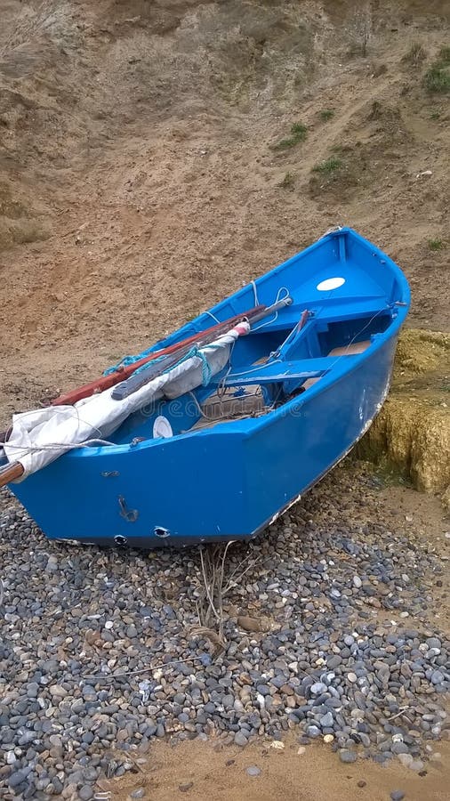 Blue rowing boat on beach stock photo. Image of seaside - 59679844