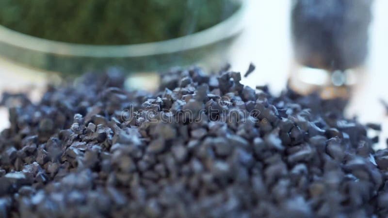 Blue Rubber Crumb Falls from Above. Green Rubber Crumb in the ...