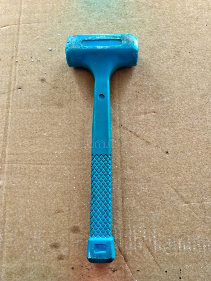Blue Rubber Mallet on a Cardboard Surface Stock Photo - Image of rubber ...