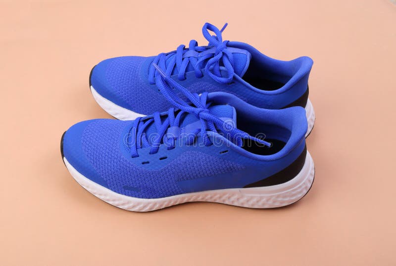 Blue running shoes stock image. Image of athletic, healthy - 205747373