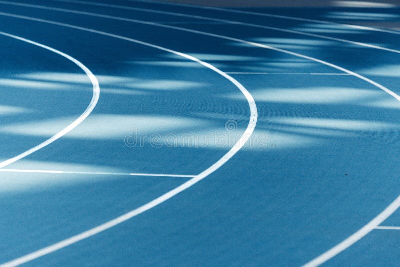 Blue Running Track with Crisp White Lines. Stock Image - Image of ...