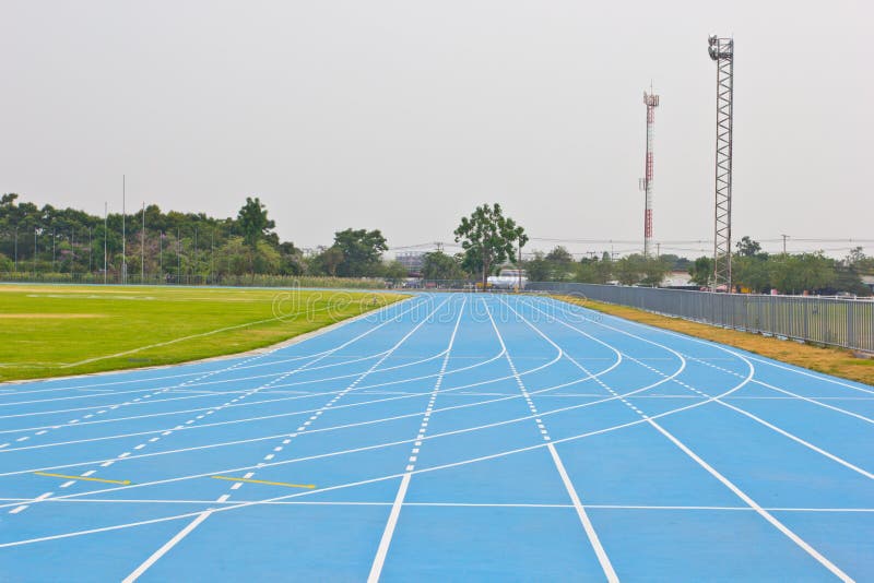 Blue running track stock image. Image of exercise, game - 30401253