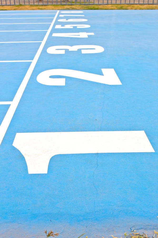Blue running track stock photo. Image of event, lawn - 30401180