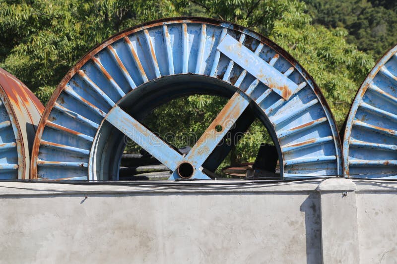 A Blue and Rusted Wire is Sitting on a Cement Wall Stock Image - Image ...
