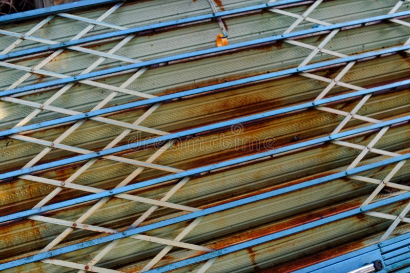 The Blue Rusty Iron Rolling Door, is a Vintage Security Door of Asian ...