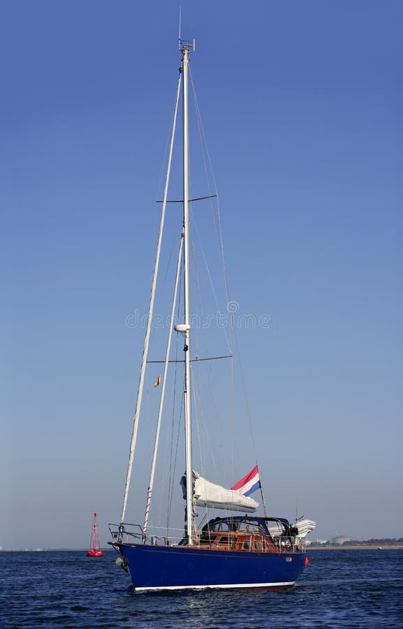 Blue Sailboat on the Canal Sailing with Engine Stock Image - Image of ...