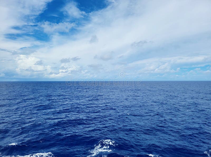 Blue Sailboat Coastal Skyline at Sunset Stock Photo - Image of beach ...