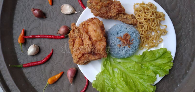 Blue Salty Rice with Crispy Fried Chicken Stock Photo - Image of ...