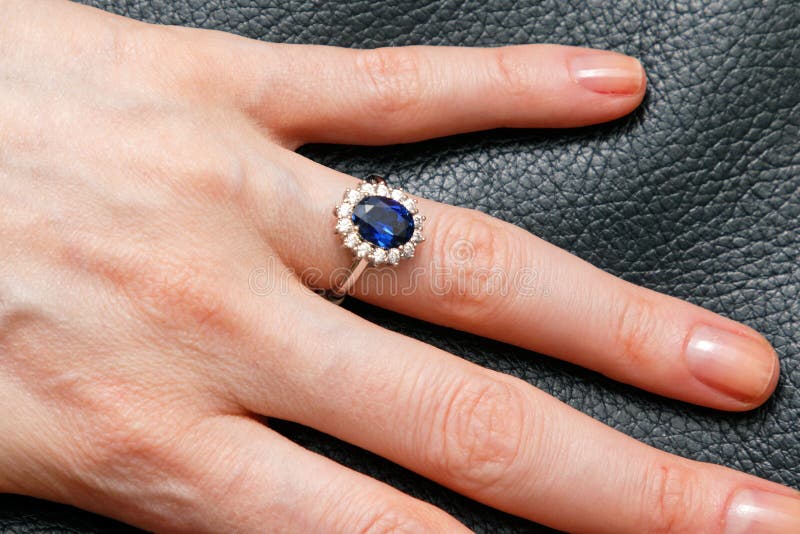 Blue sapphire ring on hand stock image. Image of luxury - 227609083