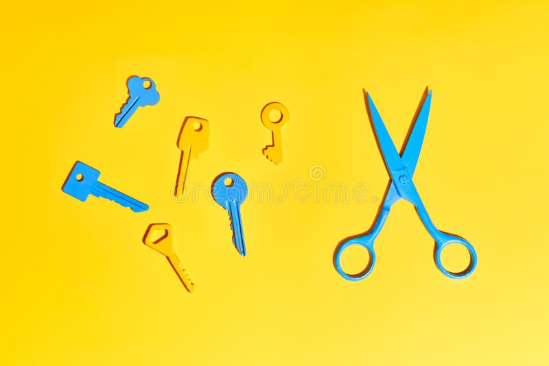 Blue Scissors and Colorful Keys on Yellow Stock Photo - Image of ...