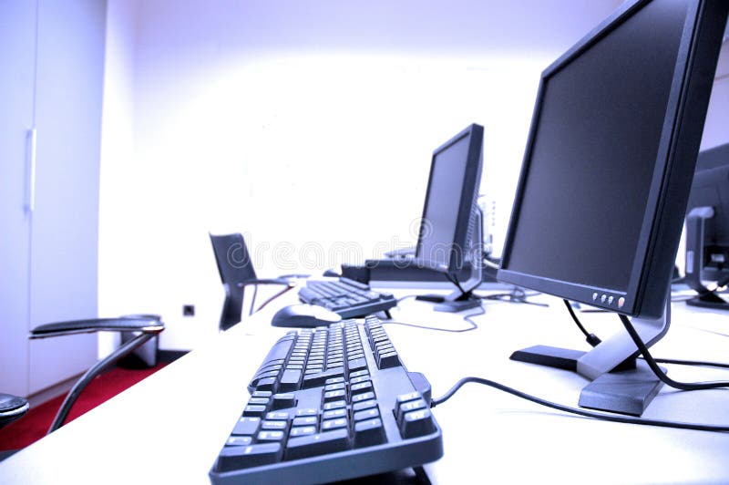 Blue Screens in Office Room Stock Photo - Image of monitors, laptop ...