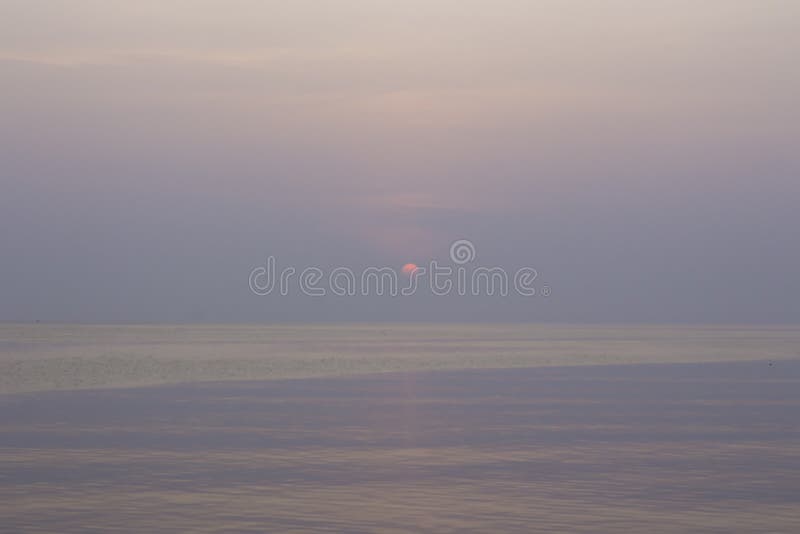 The Blue Sea in the Morning with the Rising Sun Stock Image - Image of ...