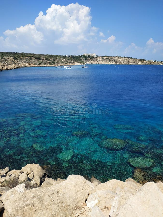 Blue Sea with Rock Shore and Ships on the Background Stock Image ...