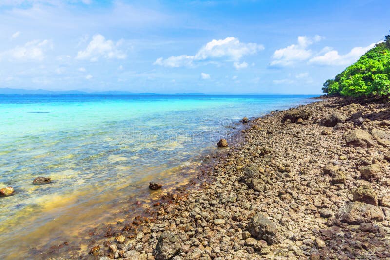 Blue Sea and Rock Stone Beach with Blue Sky Stock Photo - Image of blue ...
