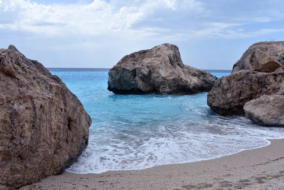 Blue Sea and Rocks on the Beach. Stock Photo - Image of rock, sand ...