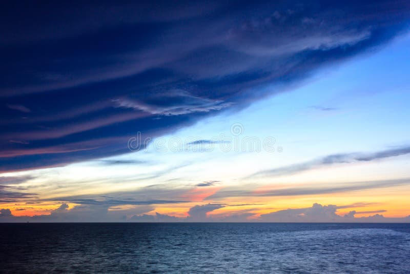 Blue Sea and Sky with Sun Red Light in the Middle Sea Stock Image ...