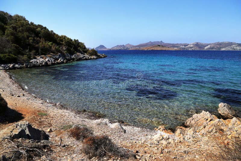 Blue sea in a small bay stock image. Image of nature - 126515727