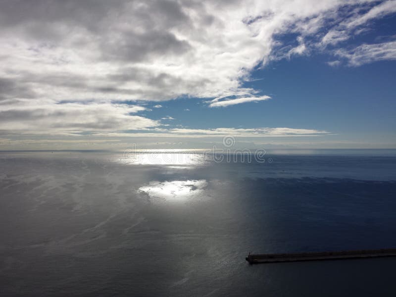 Blue sea and sun stock photo. Image of headland, playa - 55557926