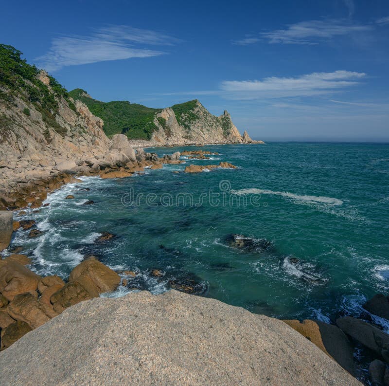 The Blue Sea is Surrounded by a Rocky Cape. Stock Image - Image of rock ...